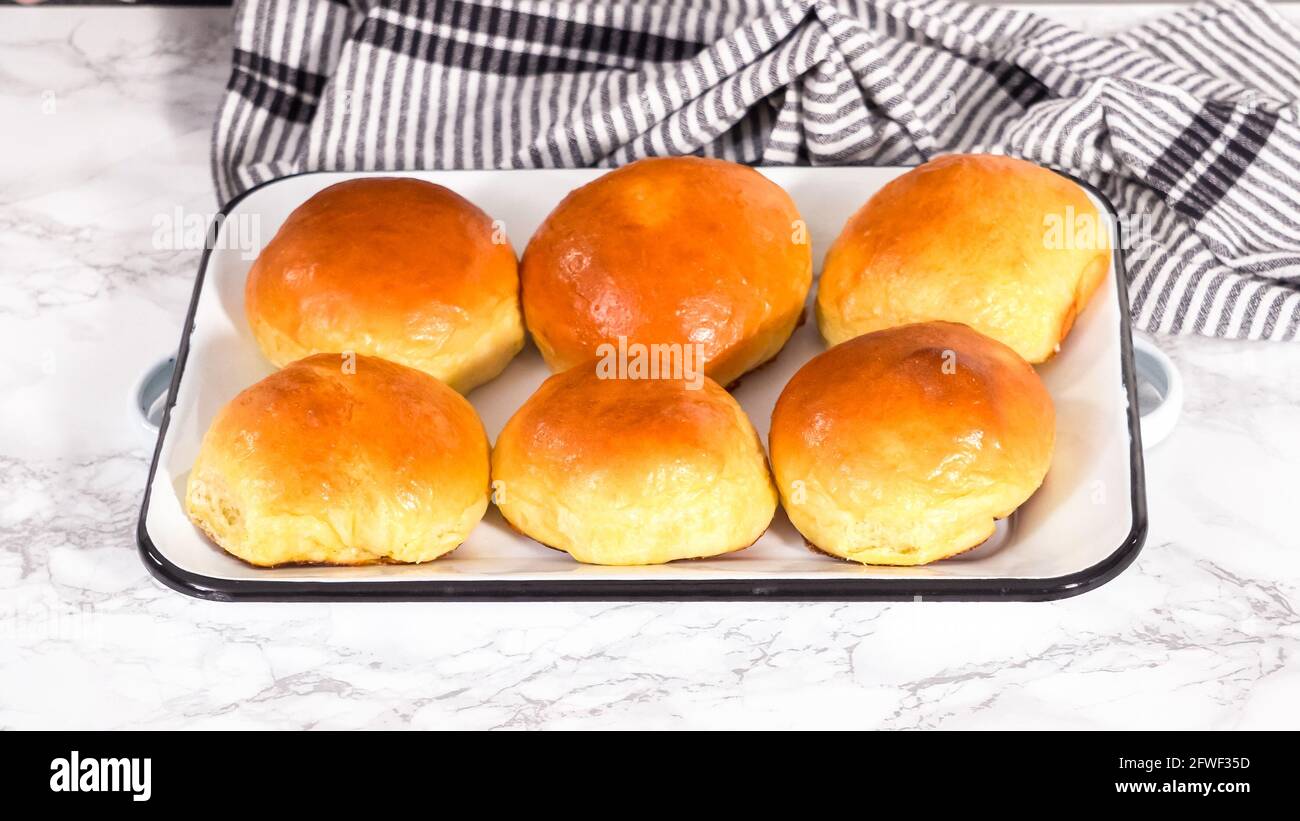 Step by step. Freshly baked brioche buns on a metal serving tray Stock ...