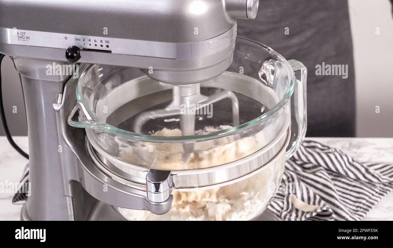 Step by step. Mixing ingredients in kitchen mixer to bake homemade ...