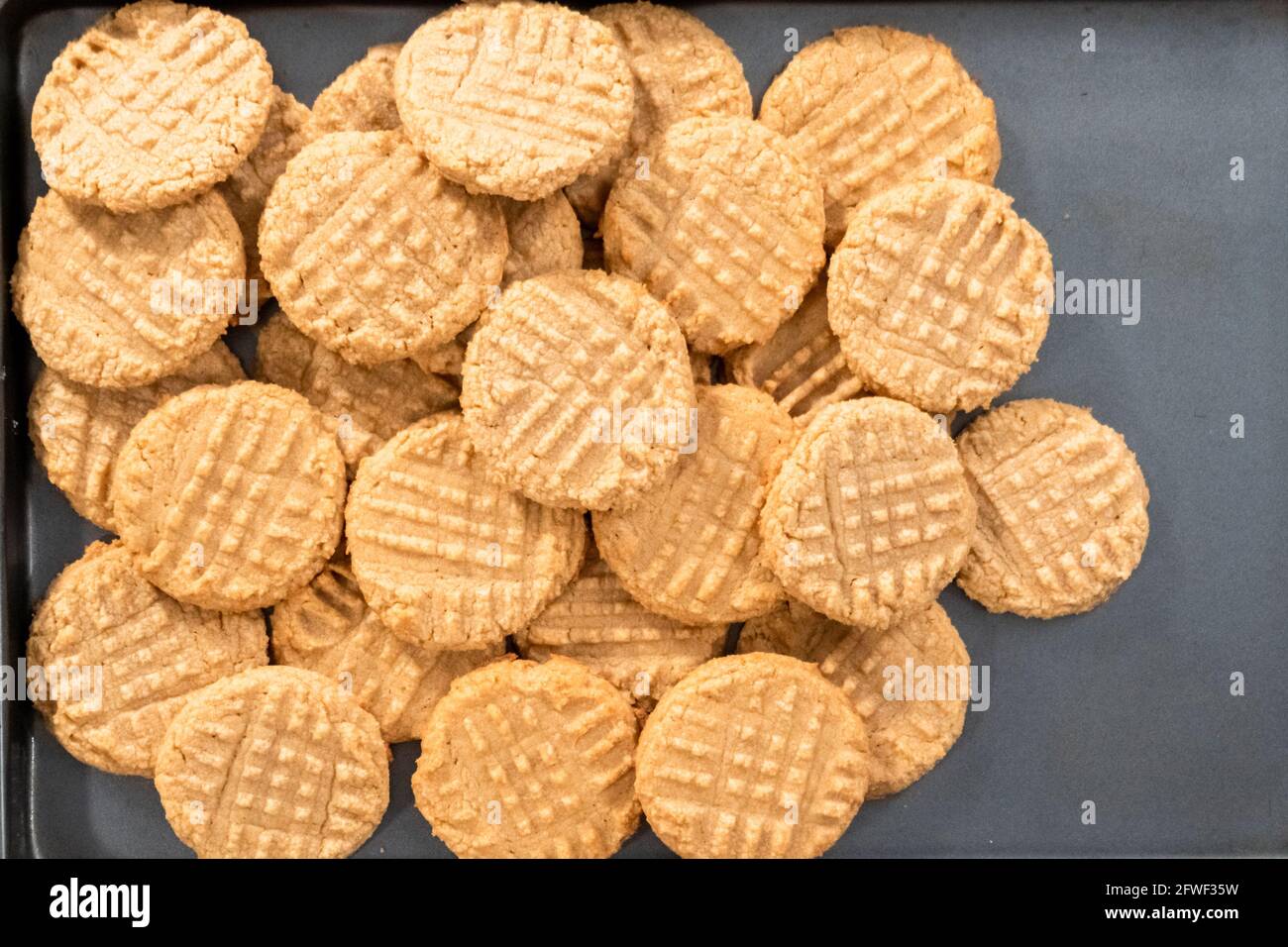 Flat lay. Pile of freshly baked peanut butter cookies Stock Photo - Alamy
