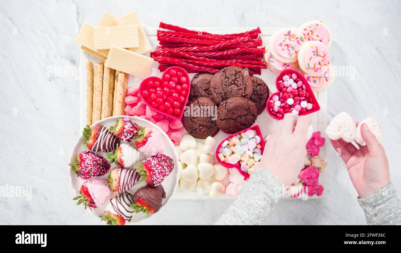 Flat lay. Step by step. Cheese board with candies and cookies for ...