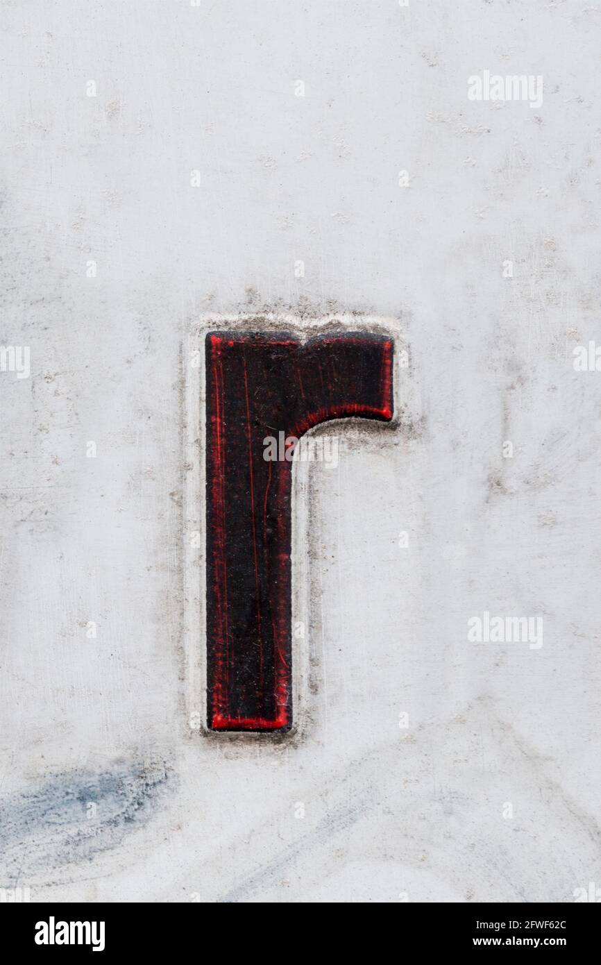 Black coloured letter r embossed on a metal plate Stock Photo - Alamy