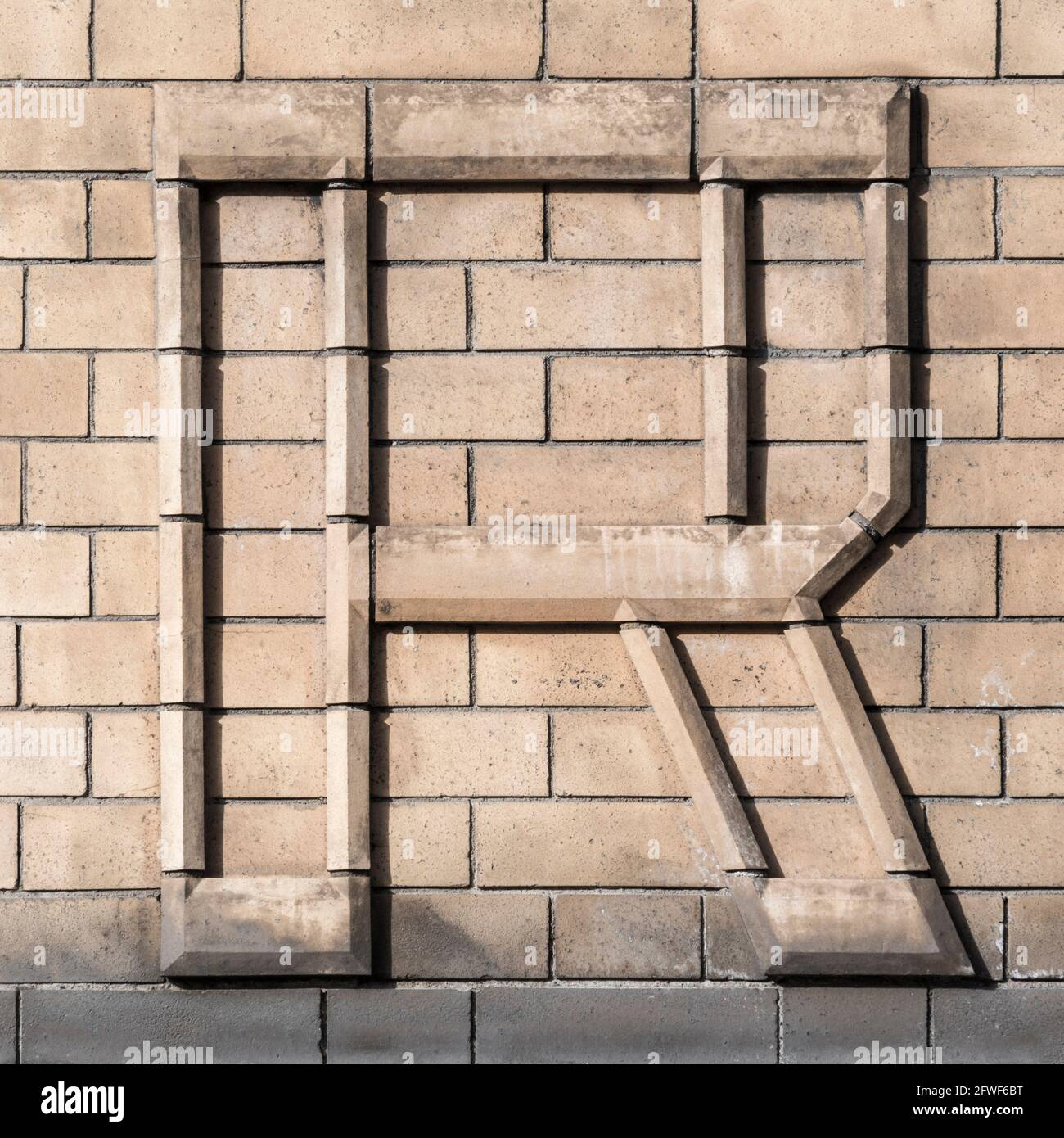 Large letter R composed of light clinker Stock Photo - Alamy