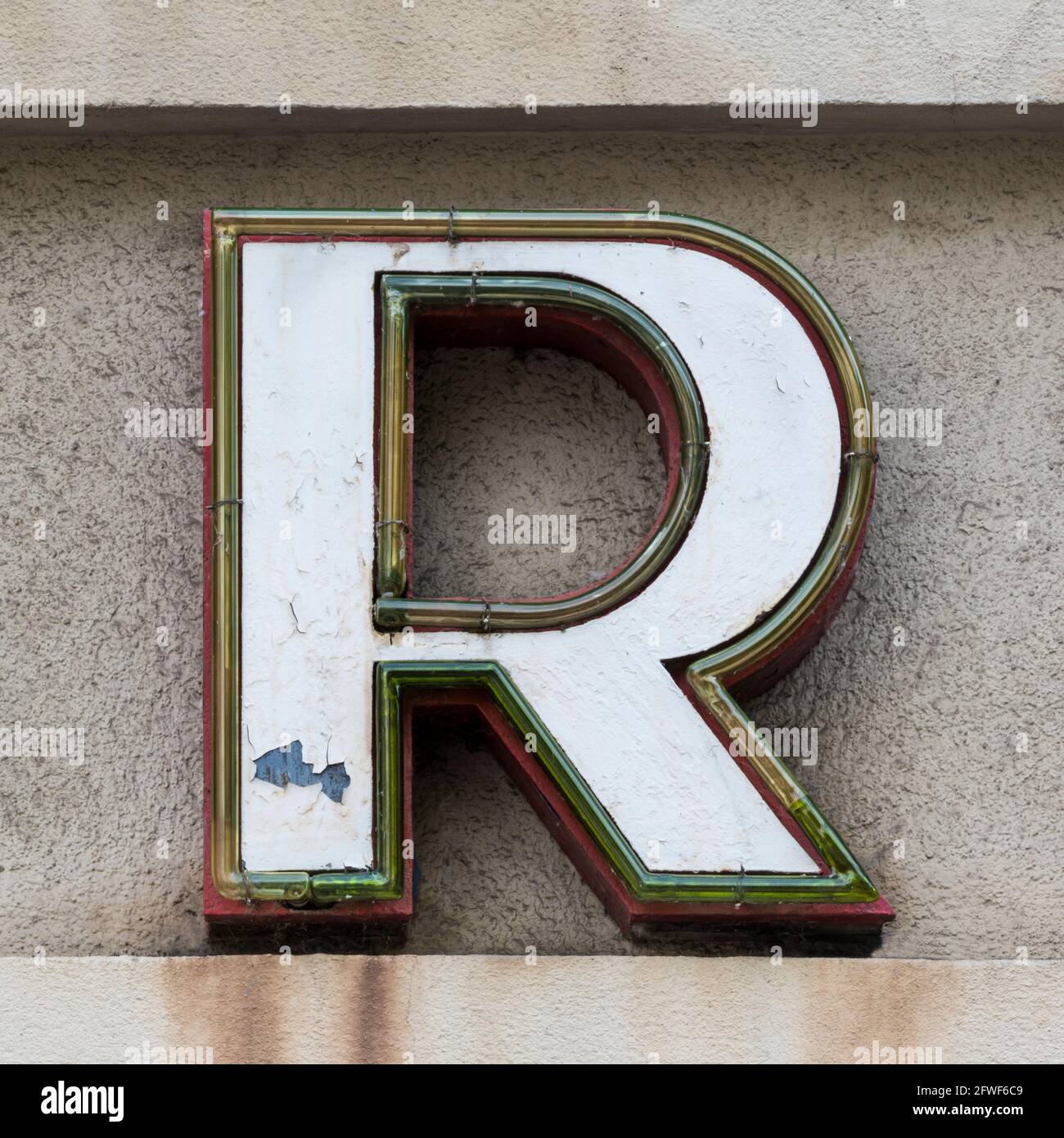 White letter R with neon tube outline Stock Photo - Alamy