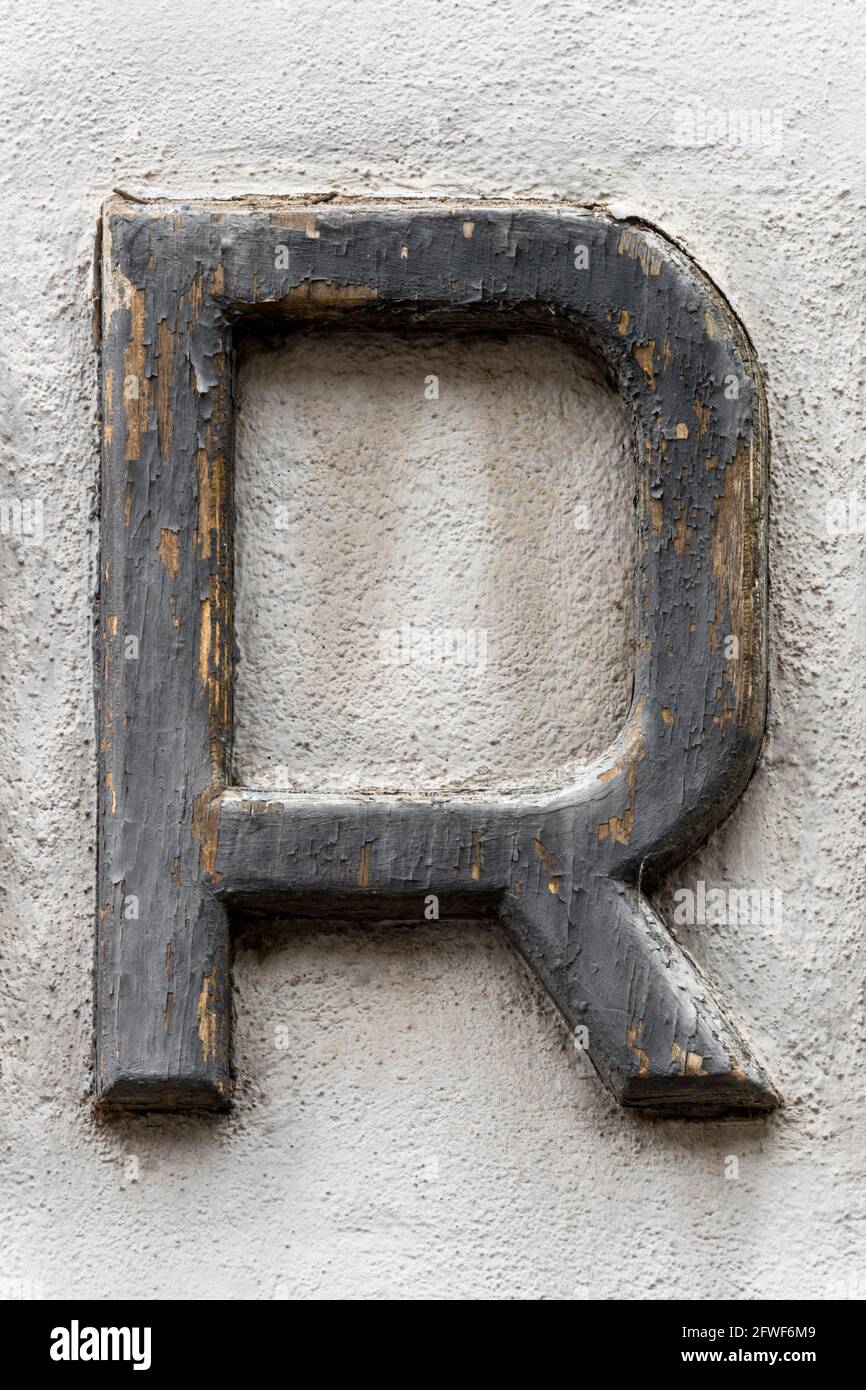 Wooden letter R with peeling black paint Stock Photo - Alamy