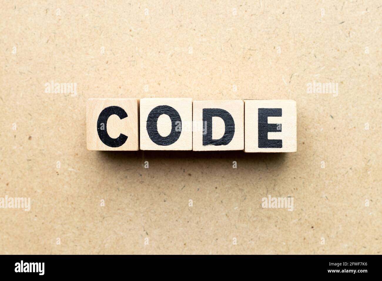 Alphabet letter block in word code on wood background Stock Photo - Alamy