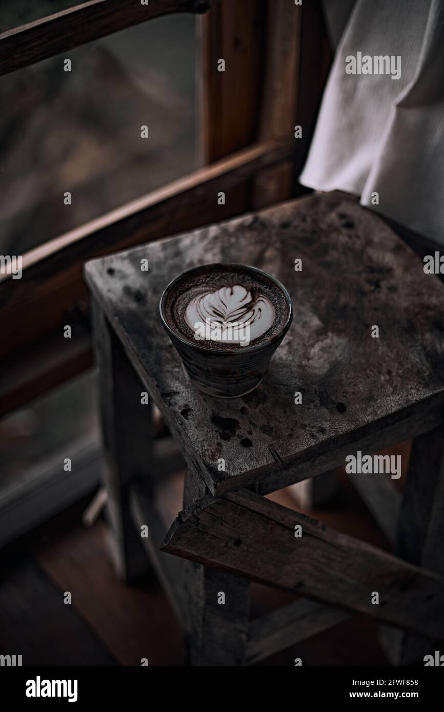 Selective focus cup of hot latte art coffee on wooden table,focus at ...