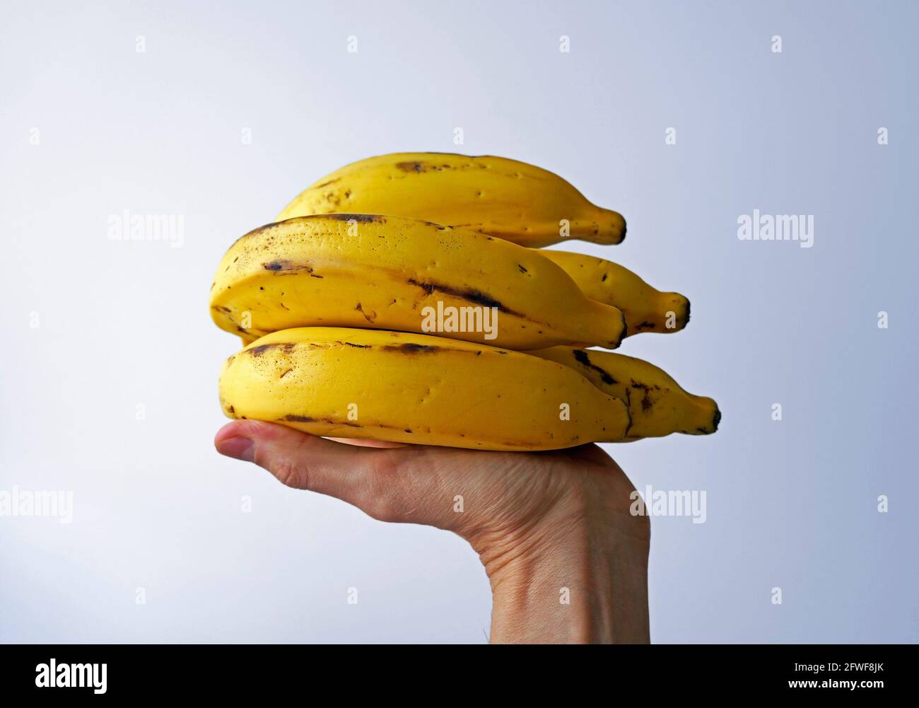 Hand of bananas hi-res stock photography and images - Alamy