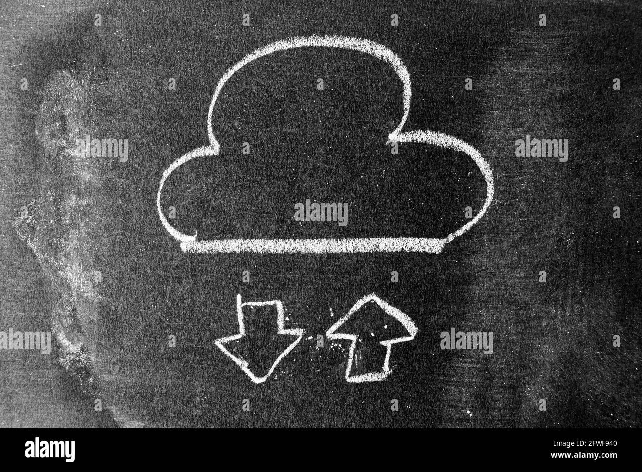 White chalk hand drawing in cloud with up and down arrow icon shape on ...