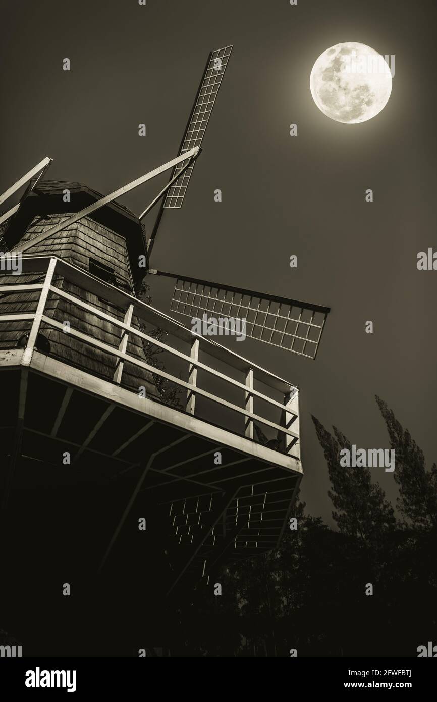 Beautiful sky and bright full moon with windmill. Outdoor. Black and ...