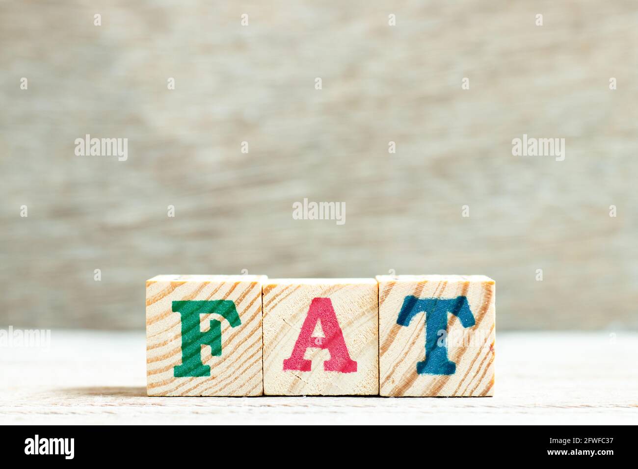 Alphabet letter block in word FAT (Obesity or abbreviation of factory ...
