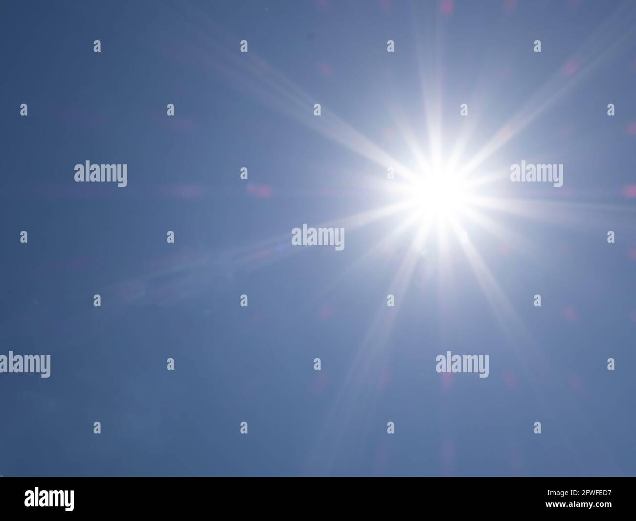 Brillant sun shining in blue sky overhead in southwest Florida USA ...