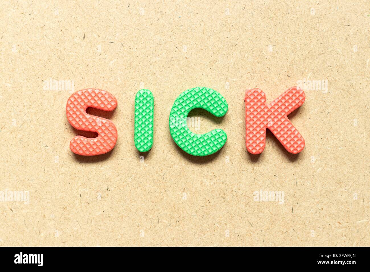 Foam alphabet letter in word sick on wood background Stock Photo - Alamy