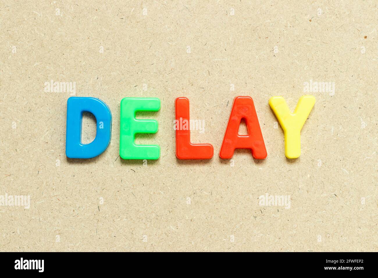 Color alphabet letter with word delay on wood background Stock Photo ...