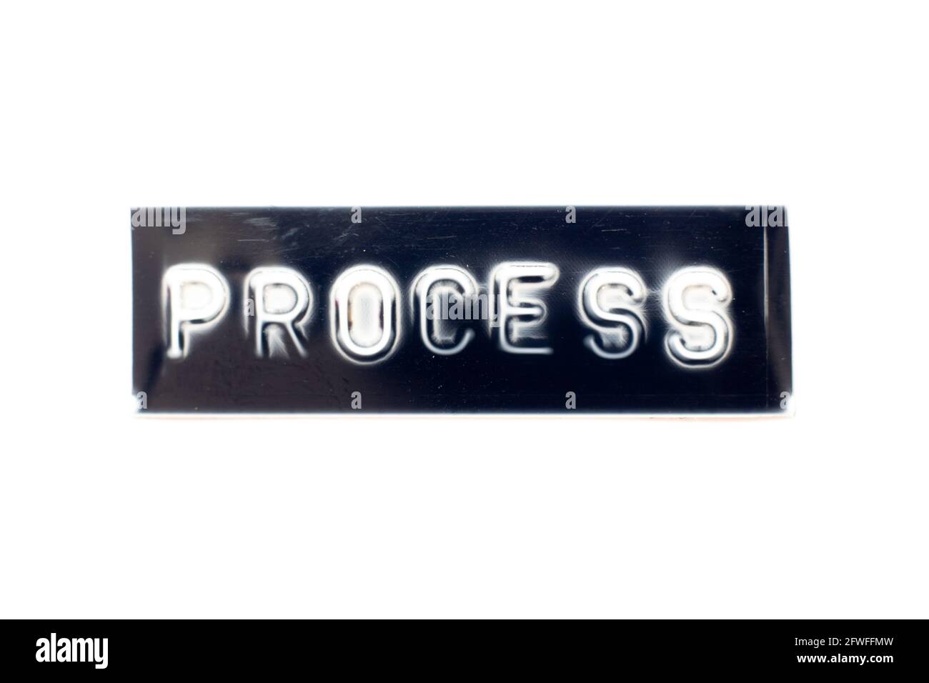Embossed letter in word process on black banner with white background ...