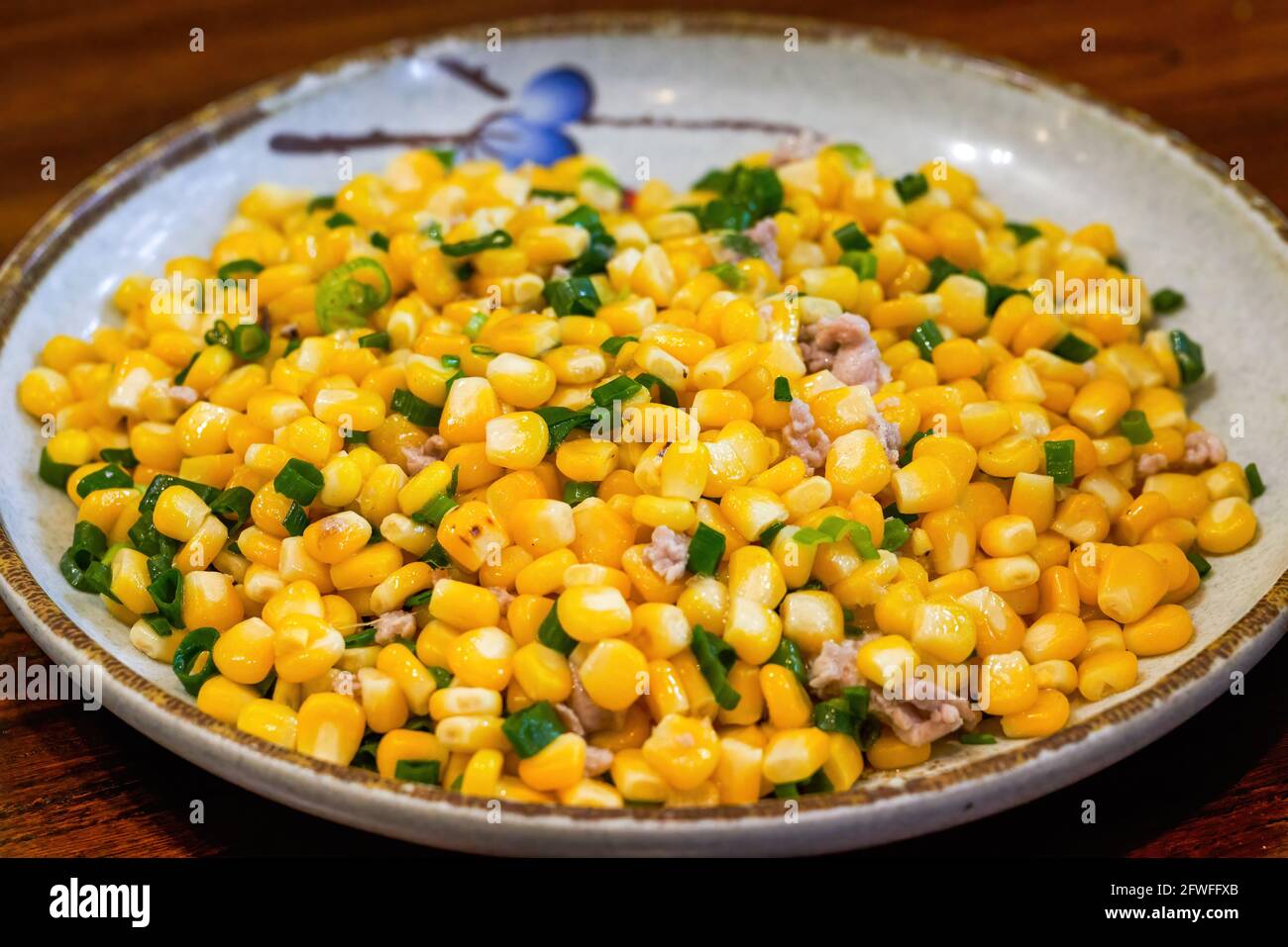 A delicious Chinese dish, fried corn with minced meat Stock Photo - Alamy