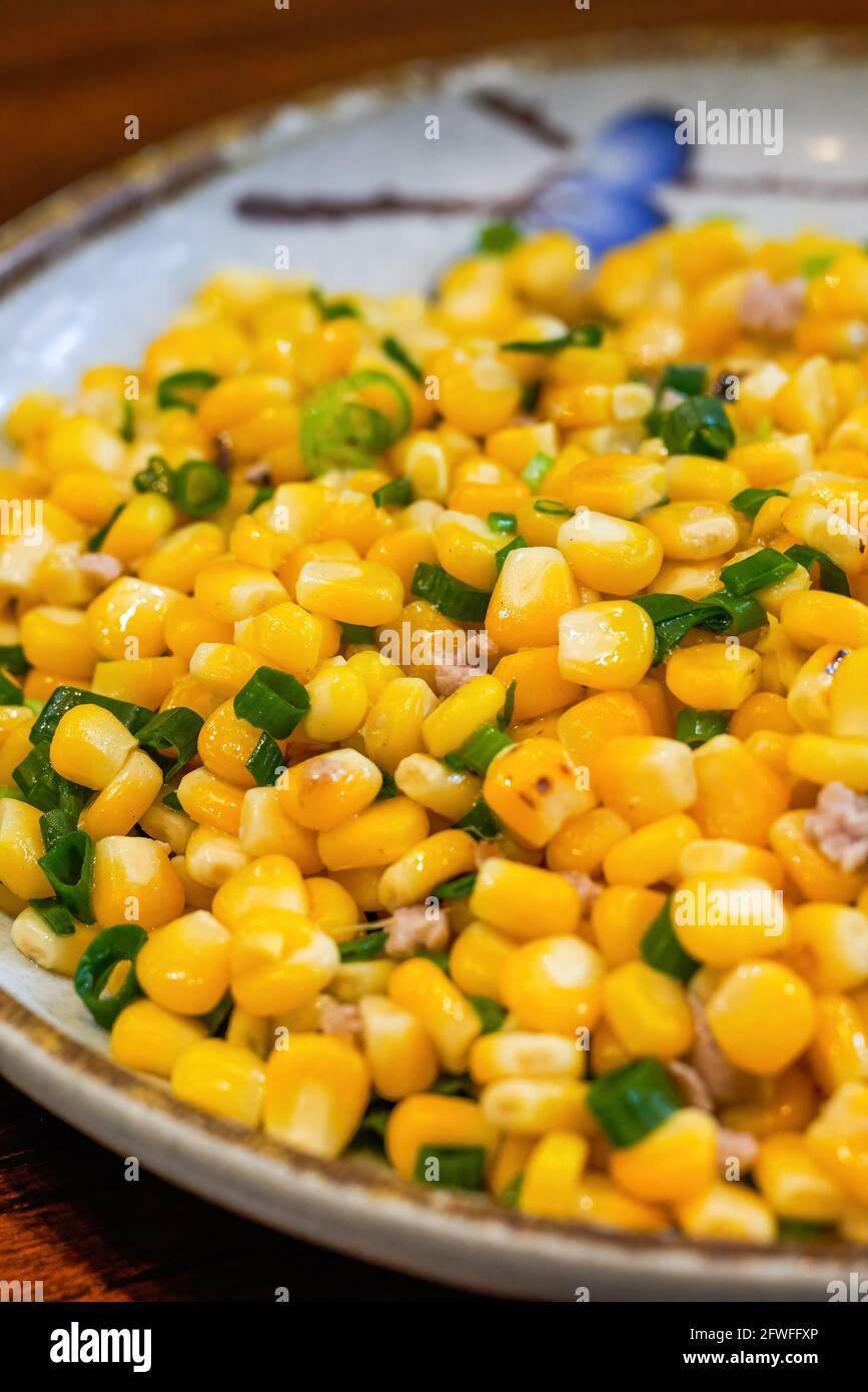 A delicious Chinese dish, fried corn with minced meat Stock Photo - Alamy