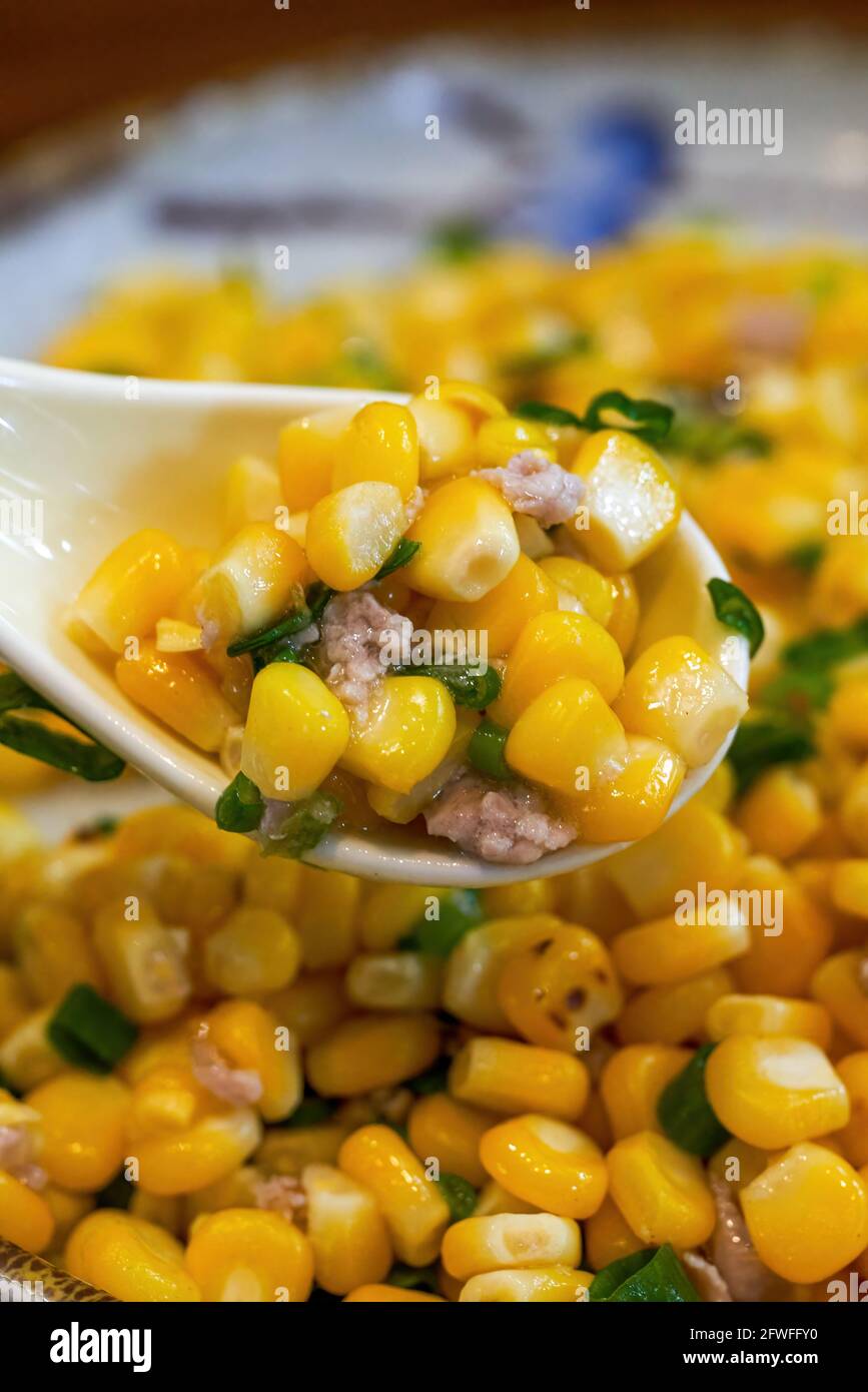 A delicious Chinese dish, fried corn with minced meat Stock Photo - Alamy