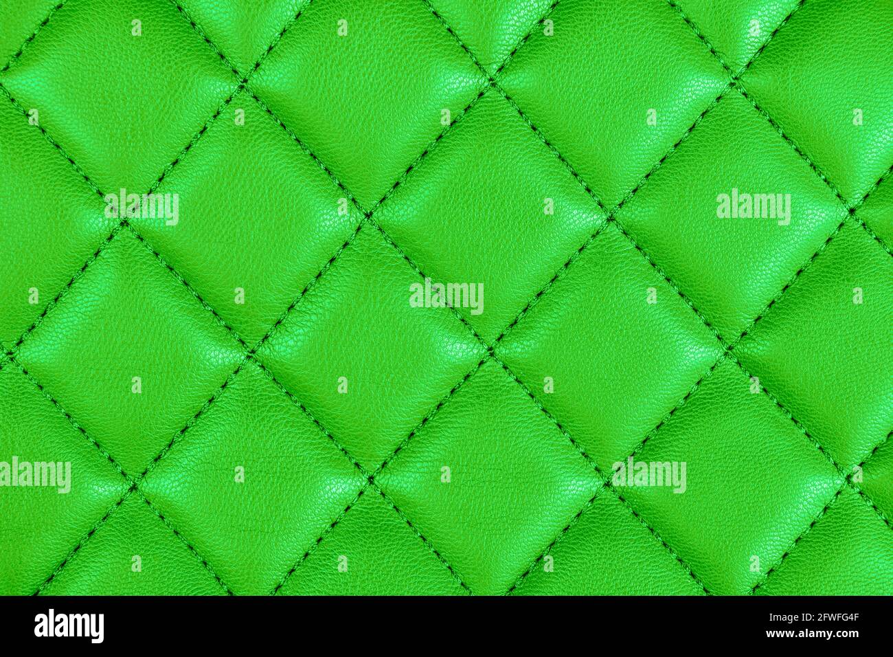 Modern luxury car green leather interior. Part of perforated leather ...