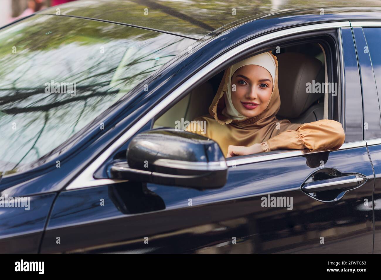Middle Eastern Woman Driving a Car, Looking Forward Stock Photo - Alamy