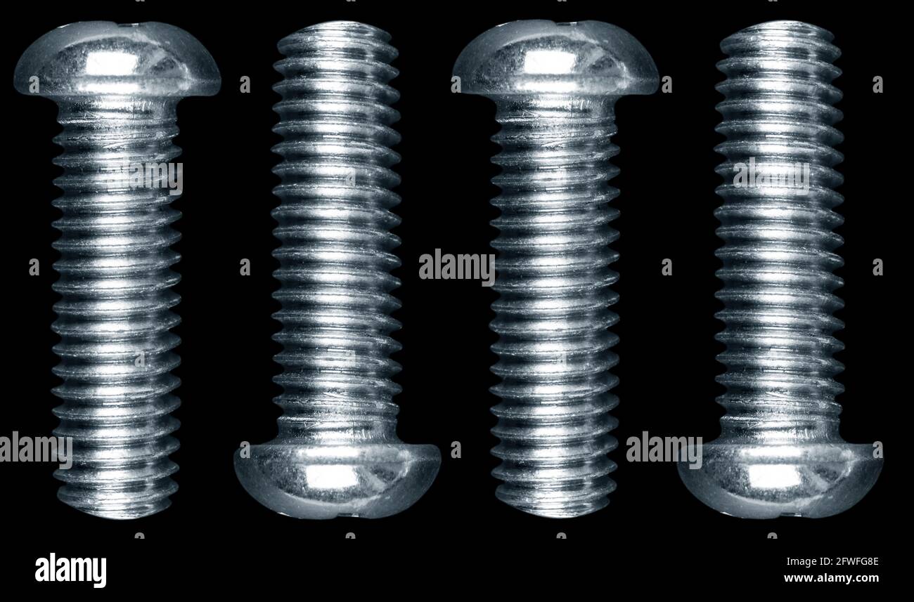 Macro shot metal bolt isolated on black background. Chromed screw bolt ...