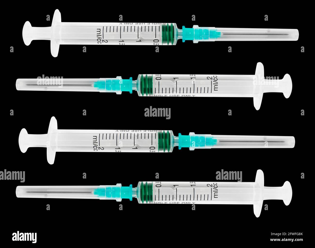 Empty syringe close up isolated on black background. Vaccine plastic ...