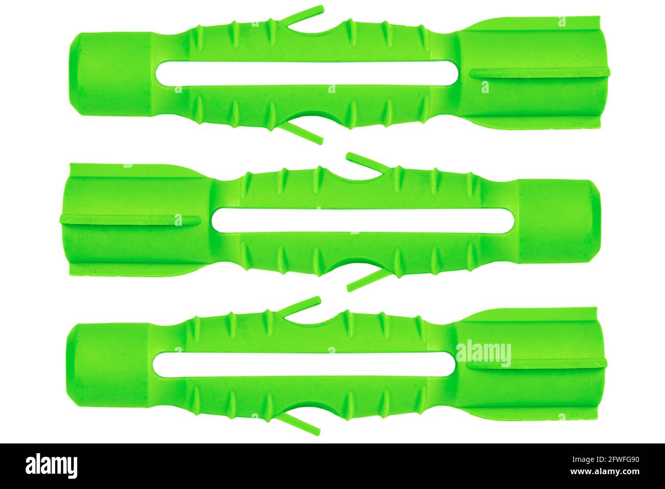 Macro shot green plastic dowel isolated on white background. Dowels ...