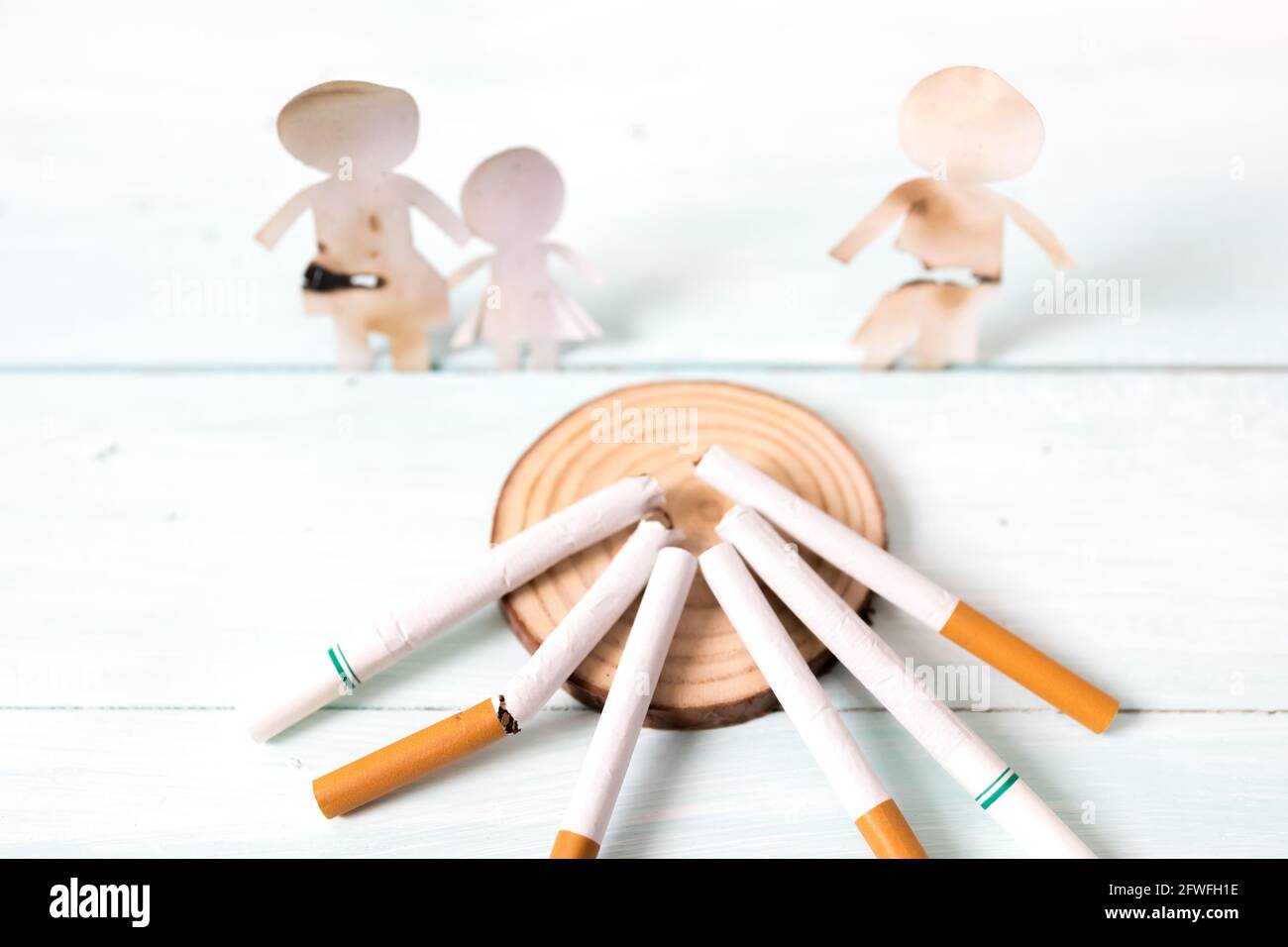 Paper cut of family destroyed by cigarettes. Drugs destroying family ...