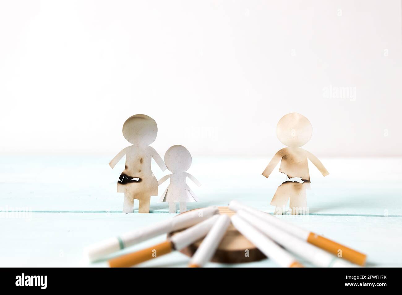 Paper cut of family destroyed by cigarettes. Drugs destroying family ...