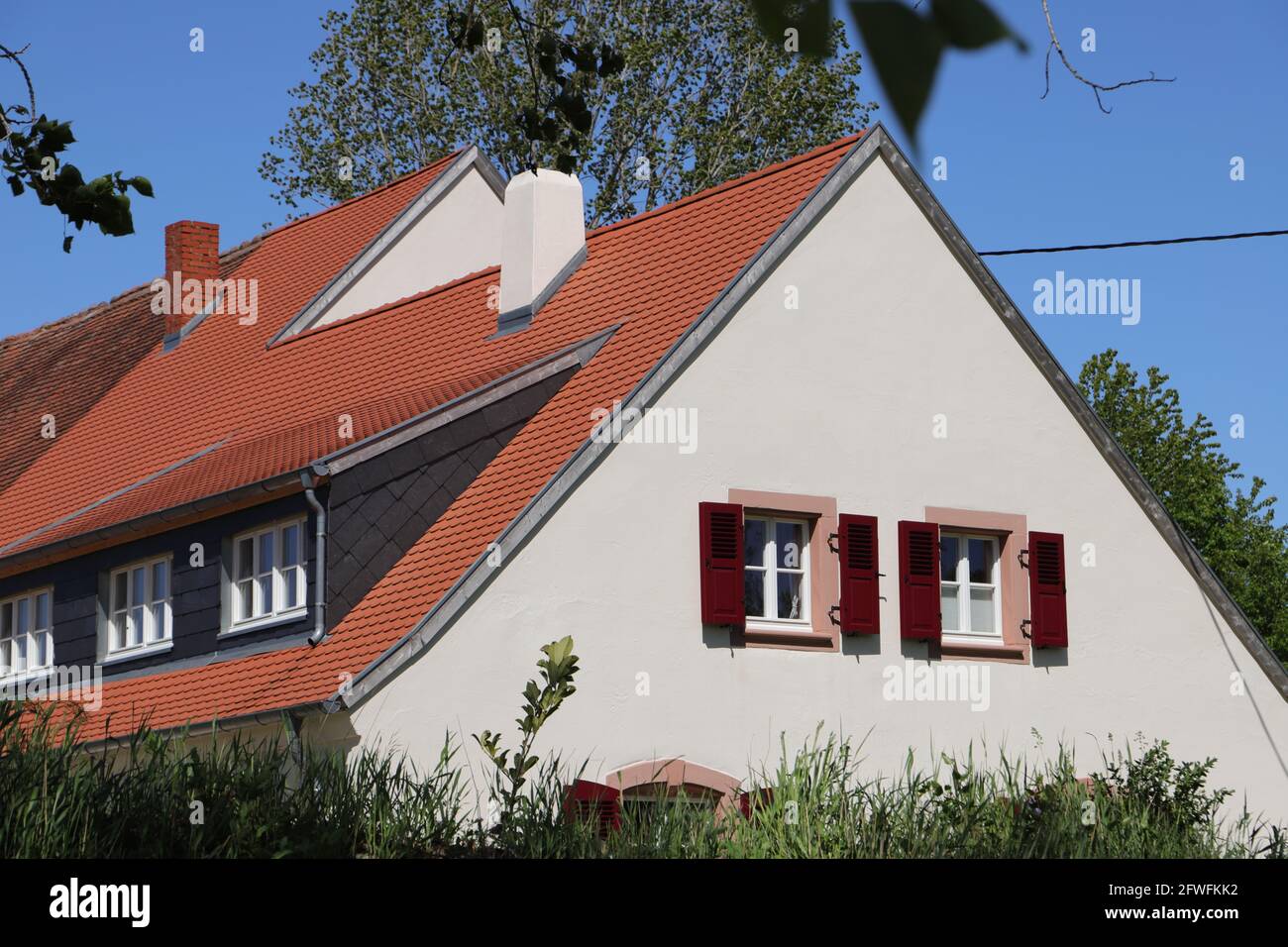 House with roof window Stock Photo - Alamy