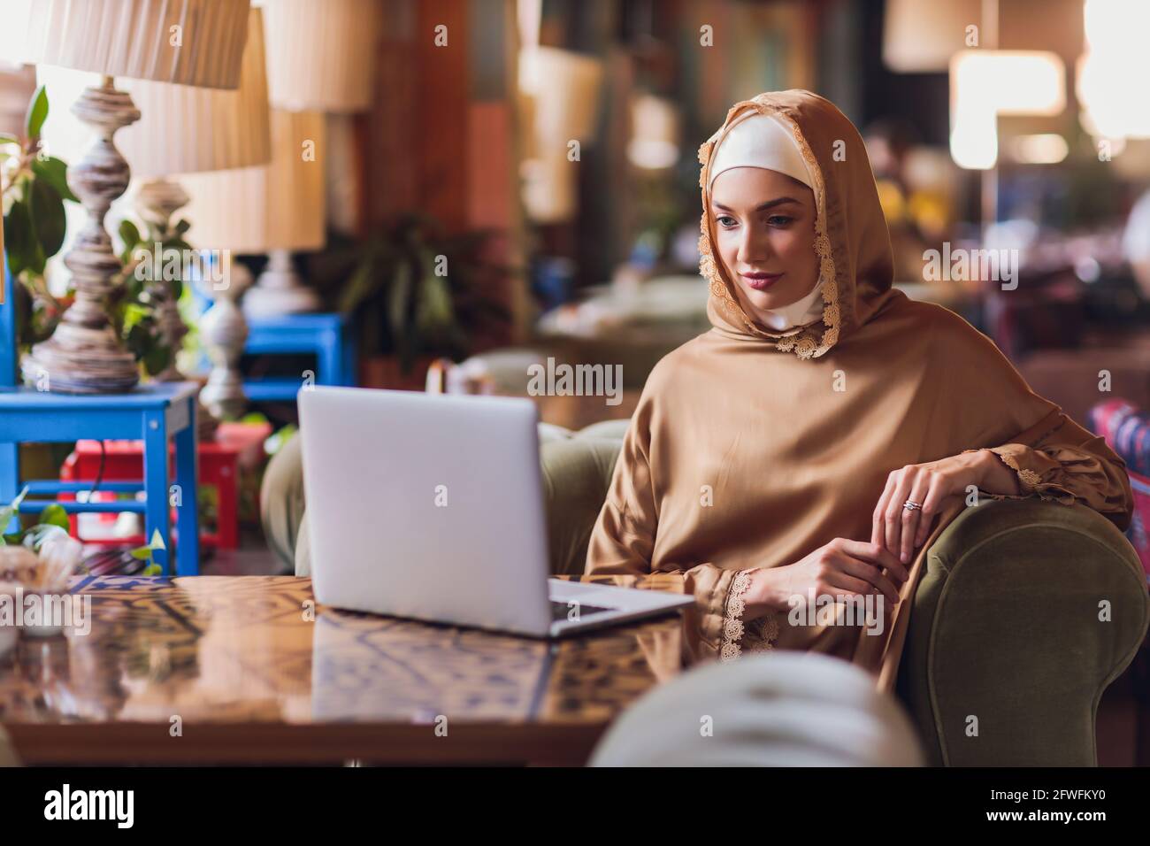 Beautiful Arabic business woman working on computer Stock Photo - Alamy