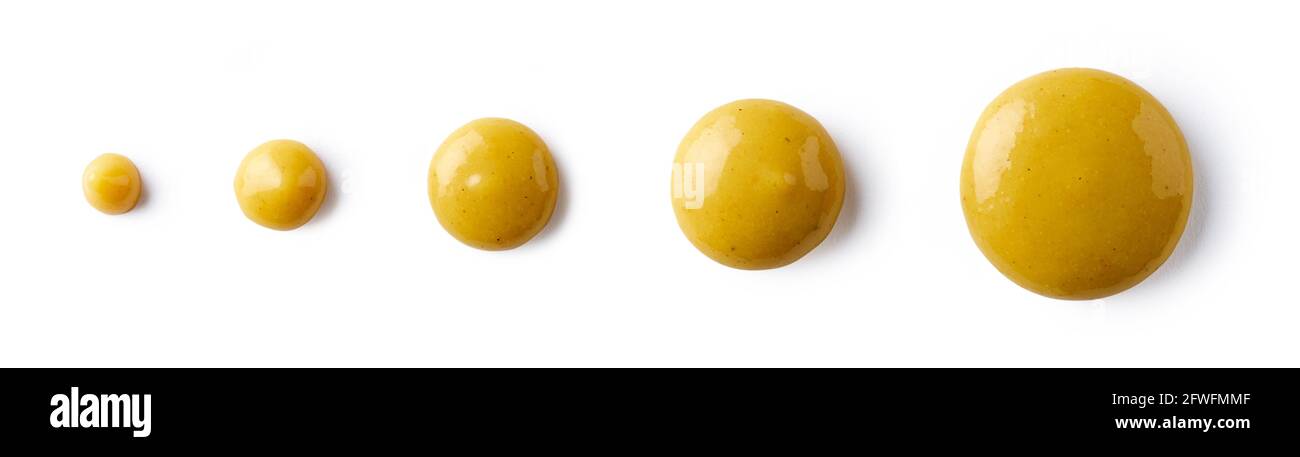 Different sized drops of mustard isolated on white background, top view ...