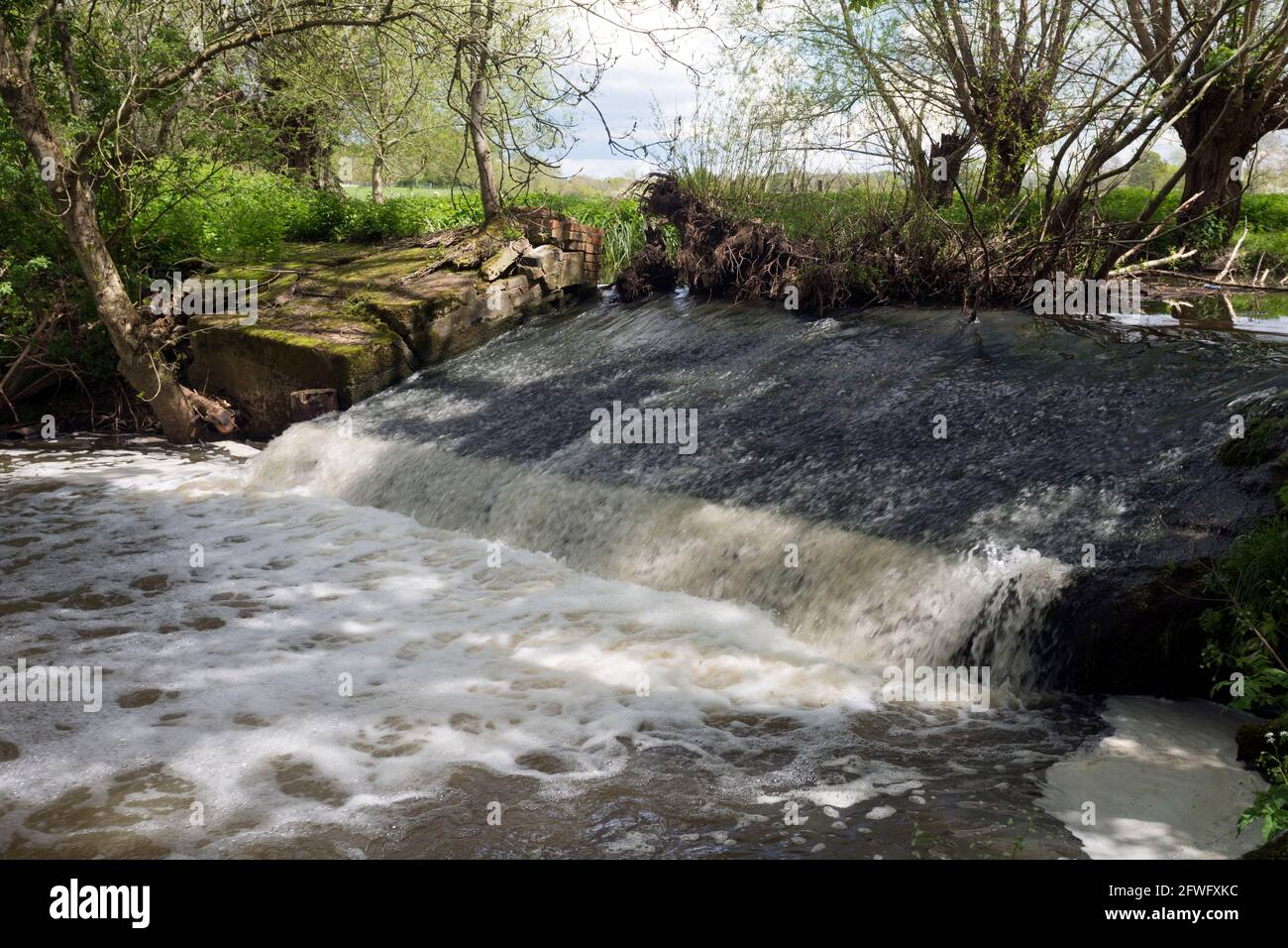 A weir on the River Alne, Great Alne, Warwickshire, England, UK Stock ...