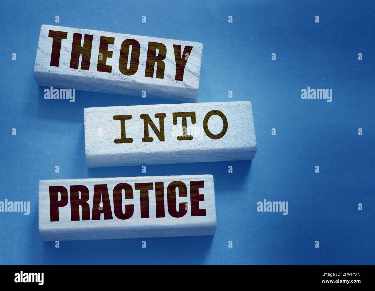 Theory into practice words written on wooden blocks. Education or ...