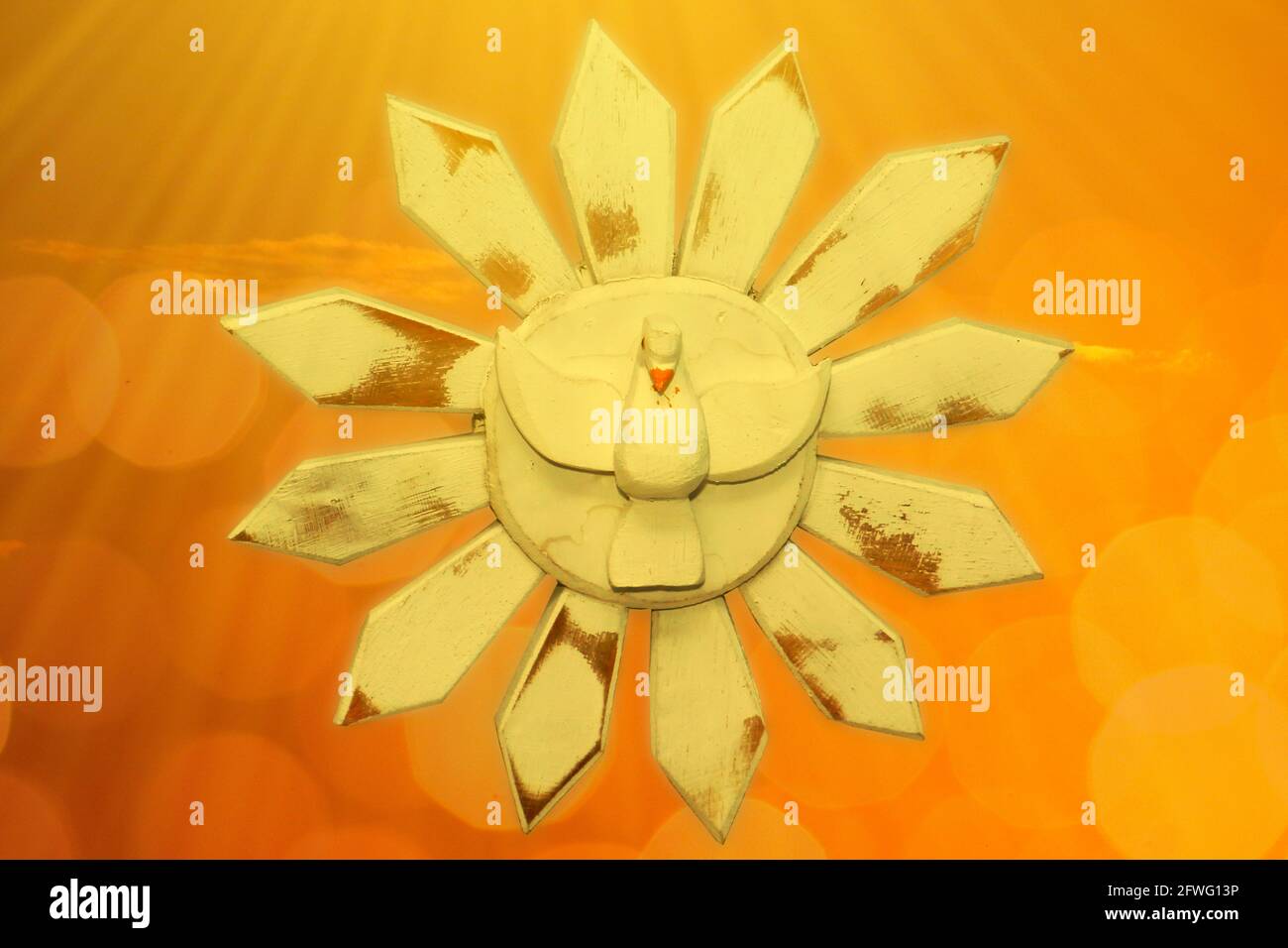 pentecost, representation of the holy spirit on bright yellow ...