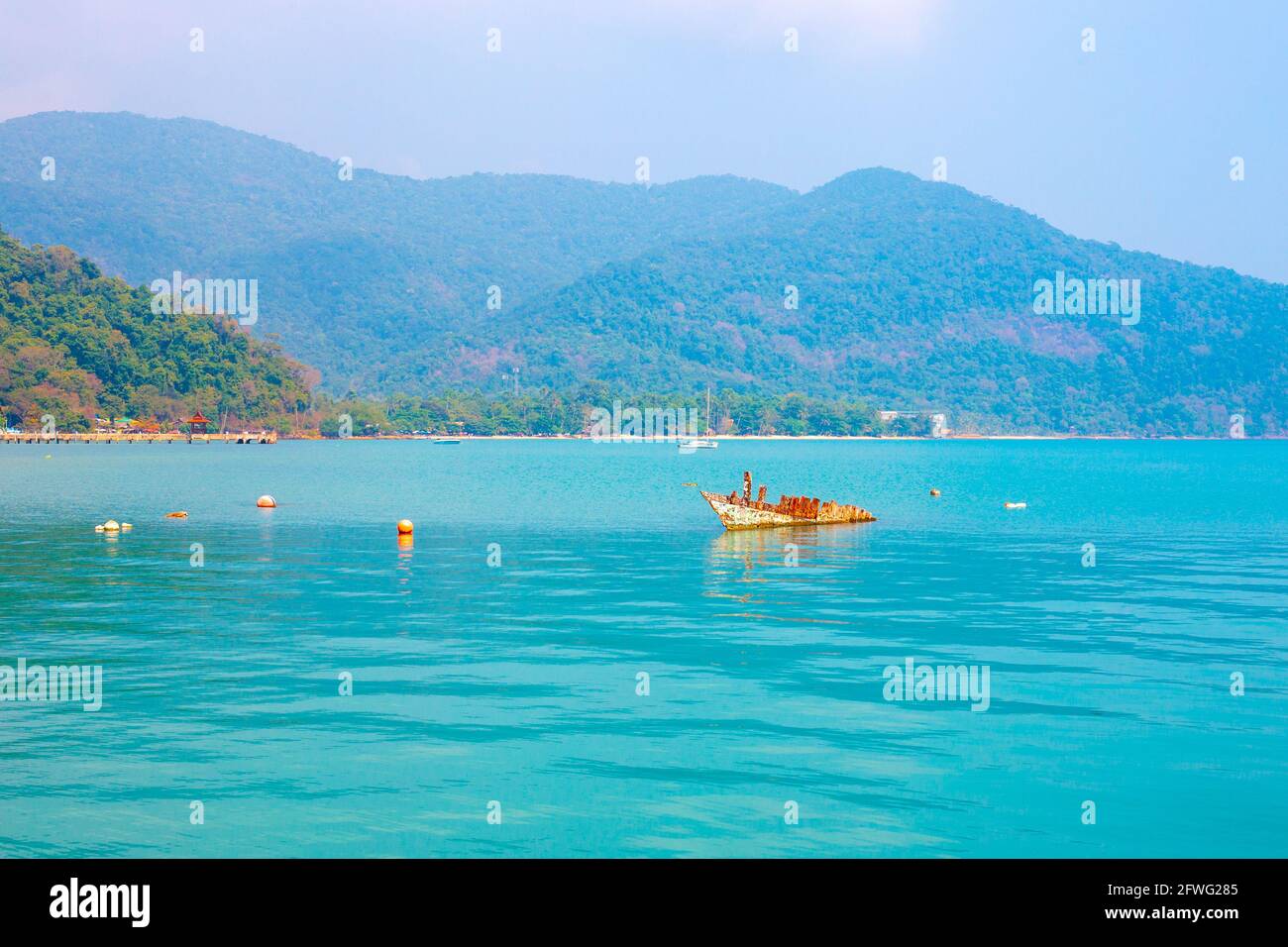 Marine tropical landscape. The remains of a broken ship against the ...