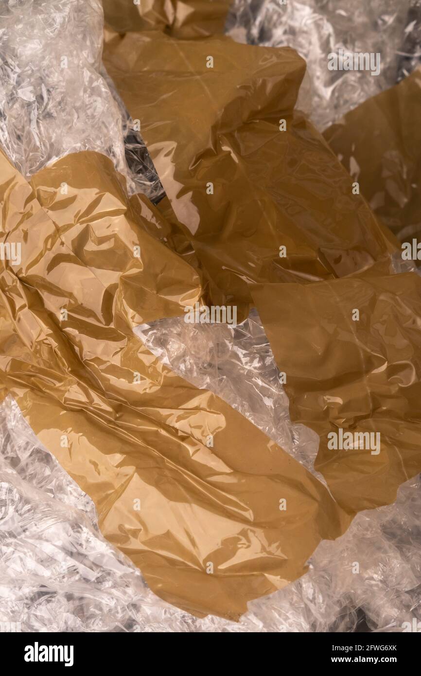 Crumpled wrinkled used packaging film close-up. Adhesive tape ...