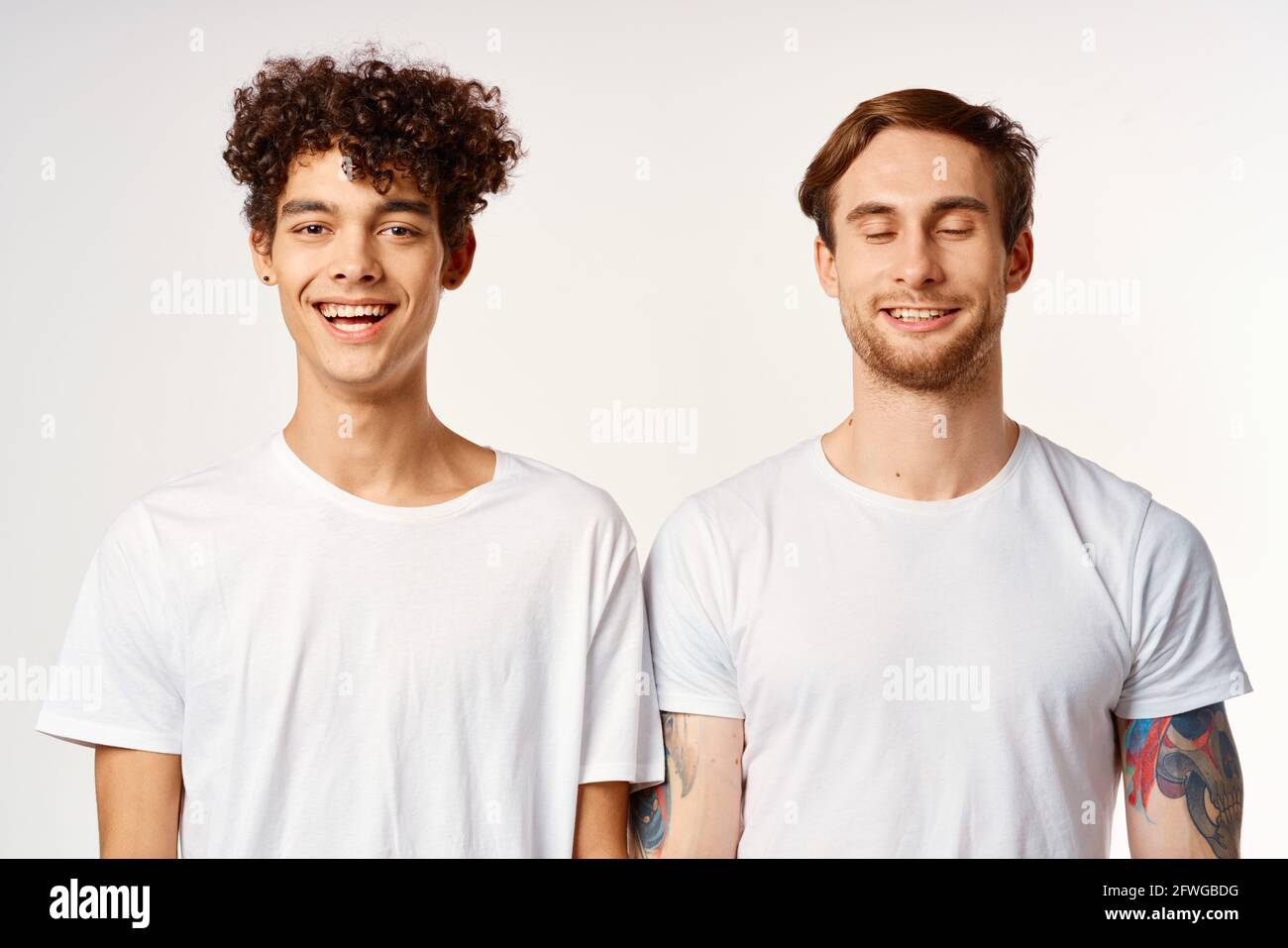 Two young friends wearing t shirts hi-res stock photography and images ...