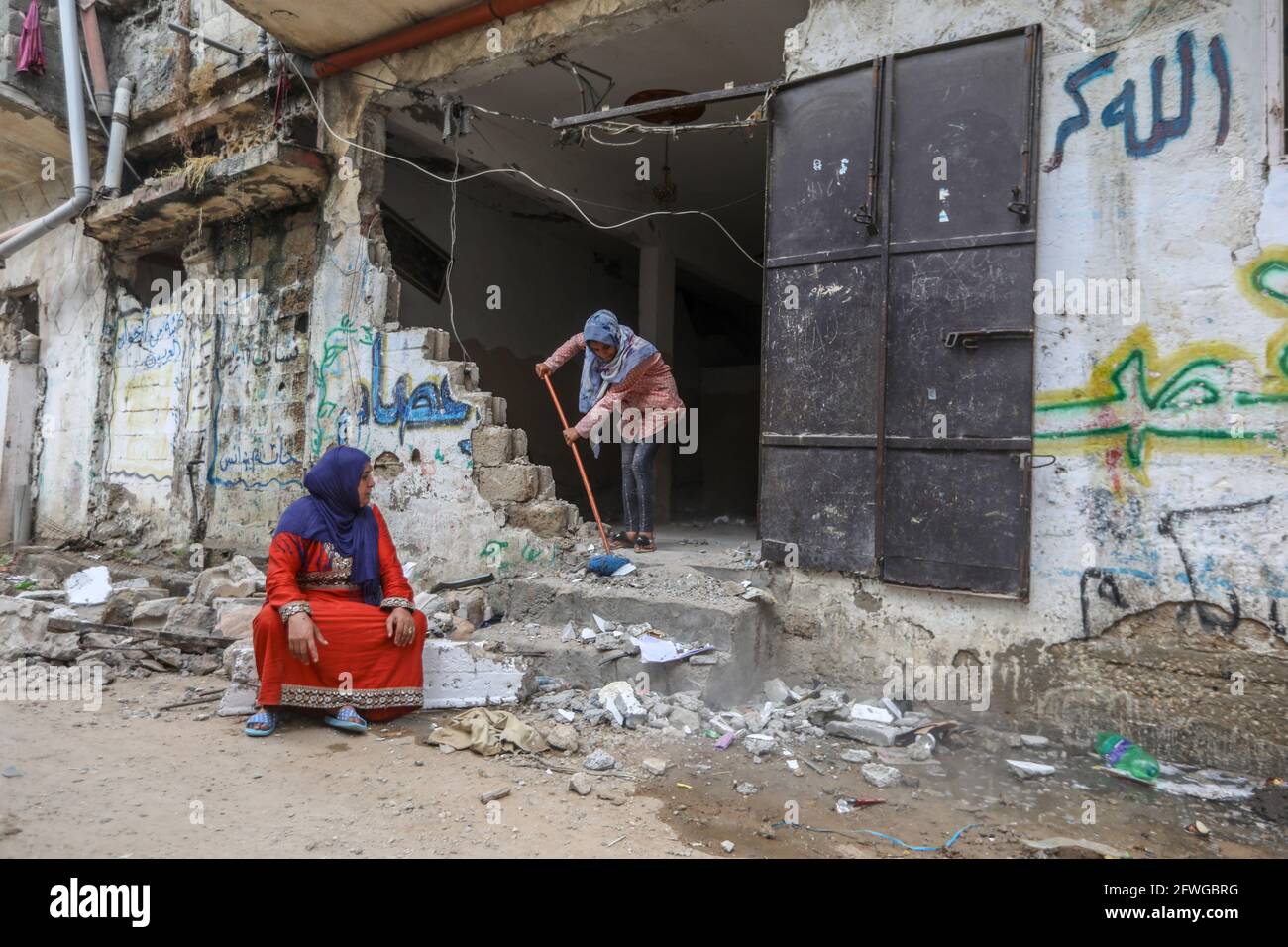 People inspect the rubble of homes and buildings which was hit by ...