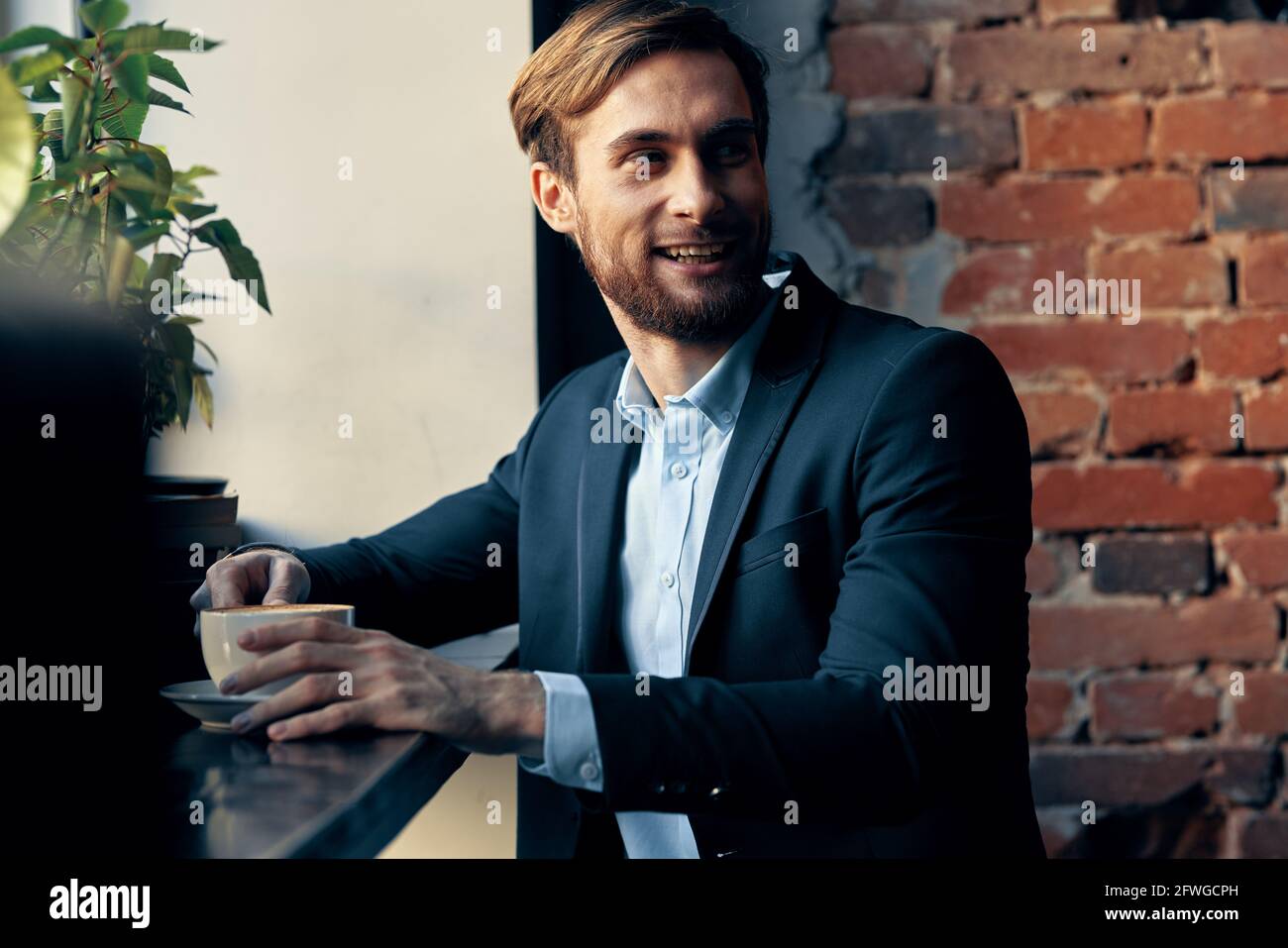 business man in a suit sitting in a cafe work leisure breakfast Stock ...