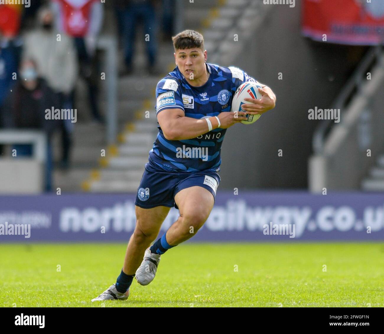 Mitch Clark (23) of Wigan Warriors runs with the ball Stock Photo - Alamy