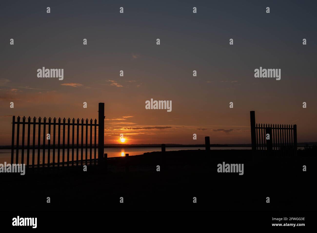 sunset at steeple essex along estuary river to the sea low light ...