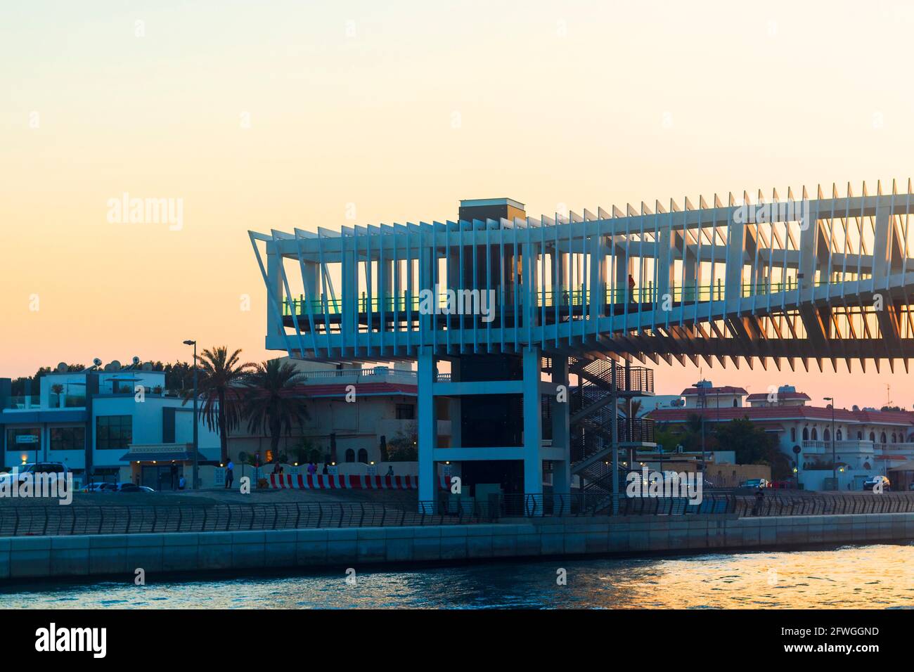 Dubai, UAE - 05.21.2021 Twisted bridge structure over a water canal ...