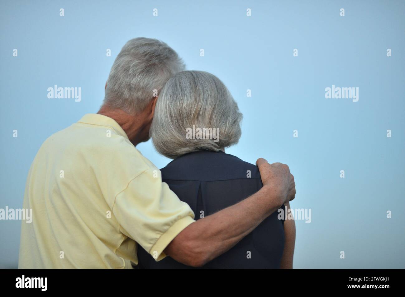 Back view. Happy elderly couple outdoors Stock Photo - Alamy