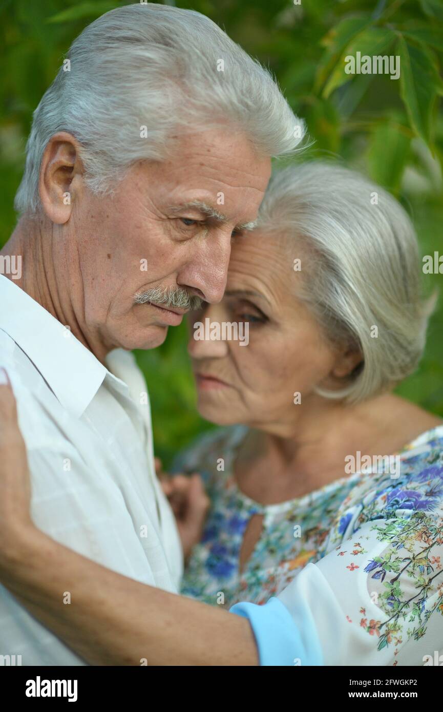 Sad couple hug park hi-res stock photography and images - Alamy