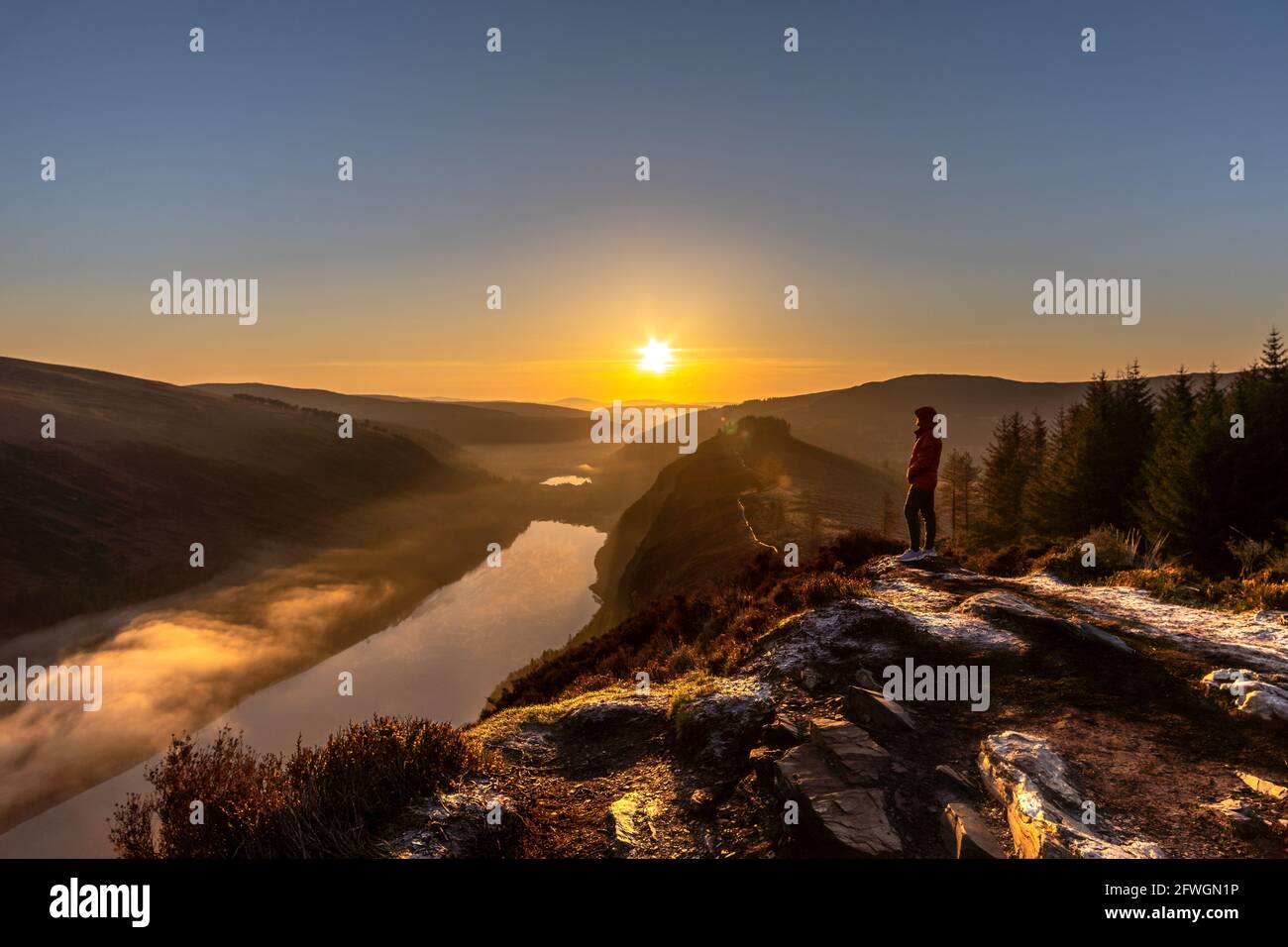 Person standing lake watching hi-res stock photography and images - Alamy
