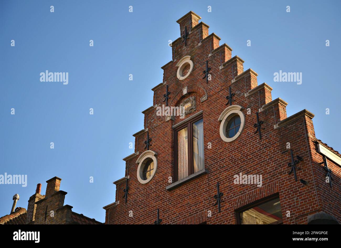 Gothic Revival style building with a brick facade and a pointed rooftop ...