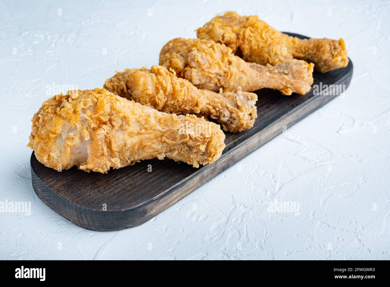Crispy fried chicken cuts on white background, with space for text ...