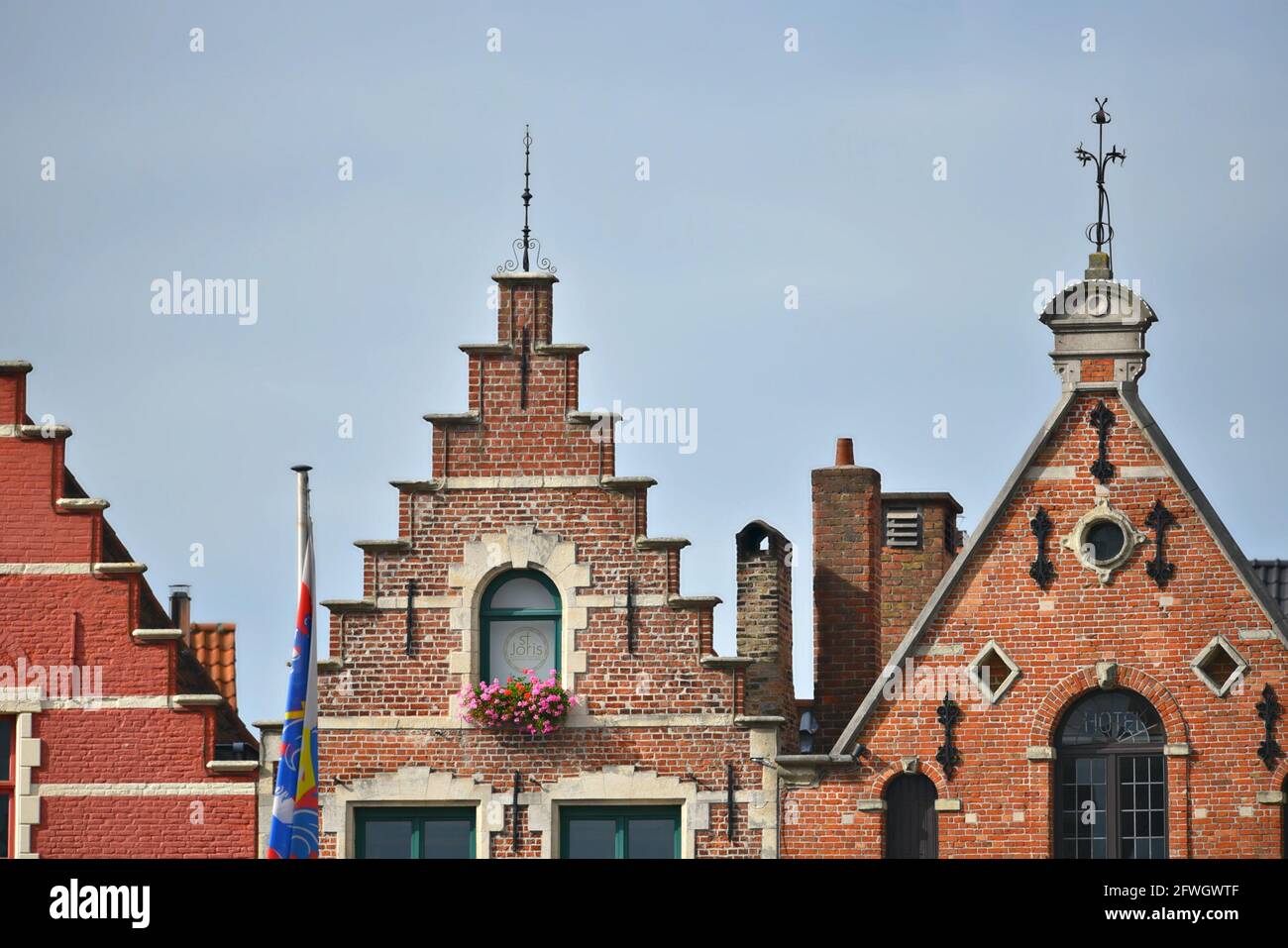 Flemish Gothic Revival style buildings with brick facades and pointed ...