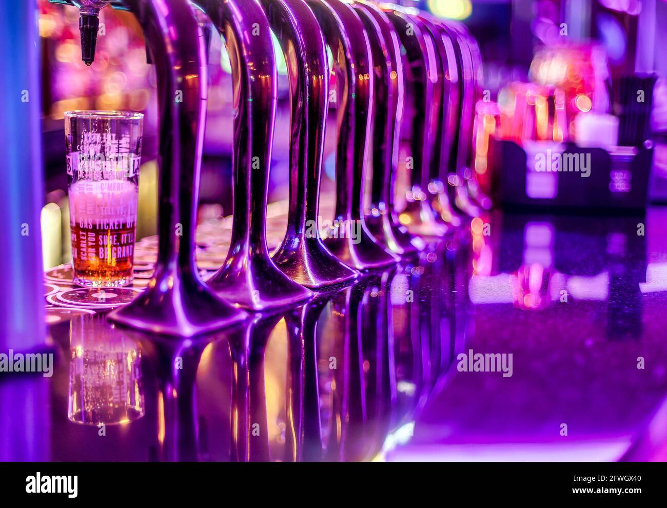 Draft beer dispensers on a bar Stock Photo - Alamy