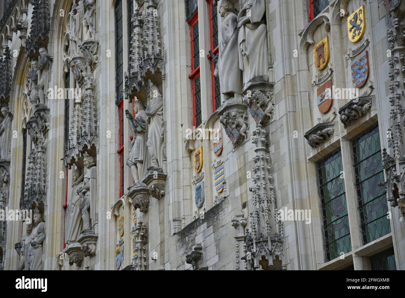 Scenic facade view with golden sculptures and stone engravings of the ...